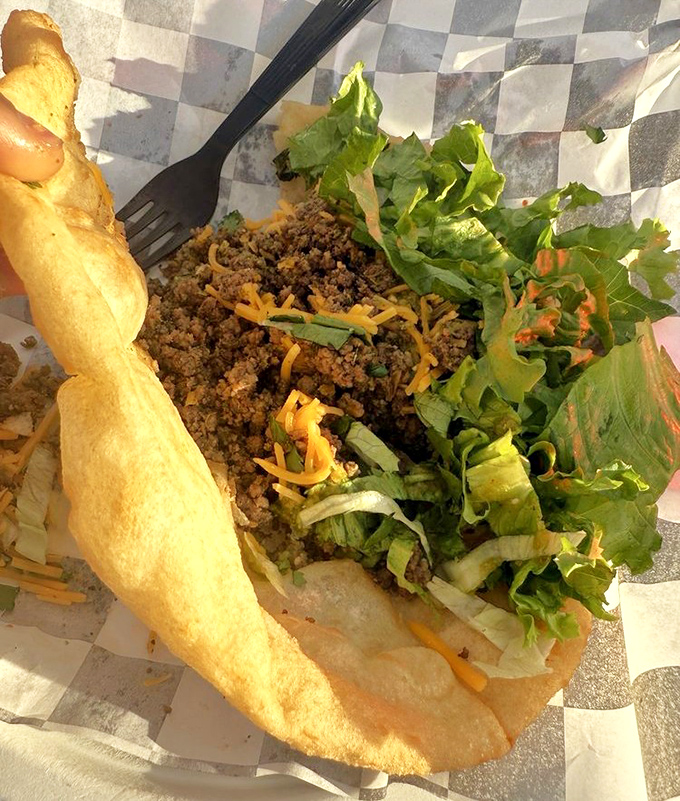 Ground beef, shredded lettuce, and melted cheese nestle in a perfectly fried shell &ndash; comfort food that transcends cultural boundaries.