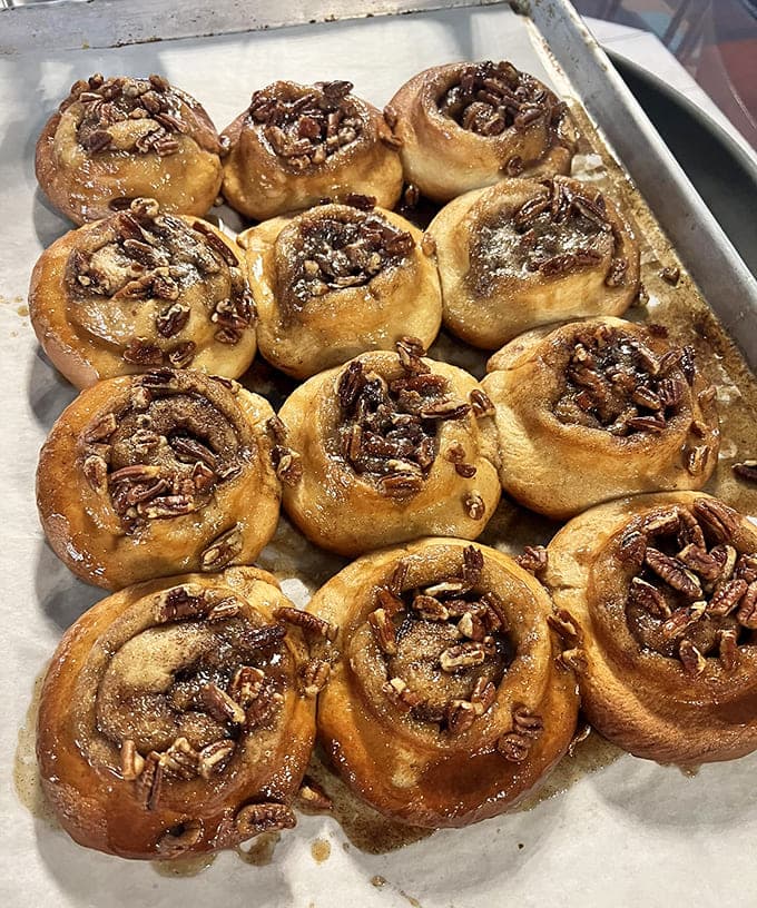 Caramel rolls glistening with sticky-sweet goodness, because sometimes you need your pastry to come with its own built-in dessert sauce.