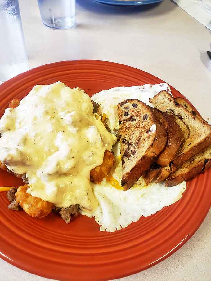 A mountain of creamy sausage gravy cascading over fresh-baked biscuits &ndash; comfort food that hugs you from the inside out.