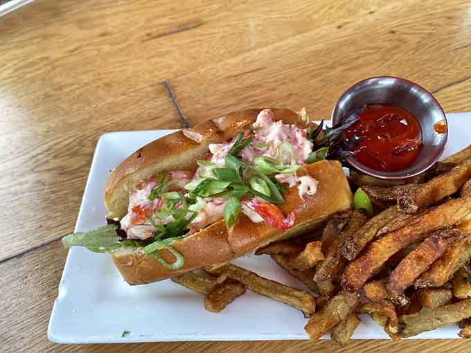 Another angle of perfection: fresh lobster nestled in a buttery toasted roll, simple yet absolutely sublime in execution.