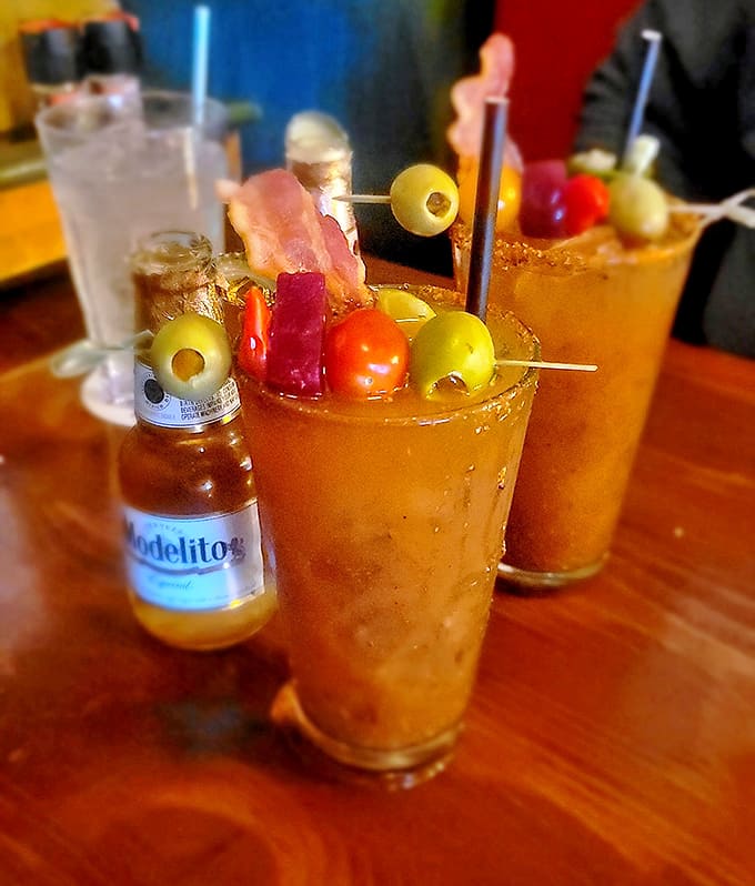 These Bloody Marys arrive loaded with olives, tomatoes, and pickles, practically a meal unto themselves and absolutely Instagram-worthy.
