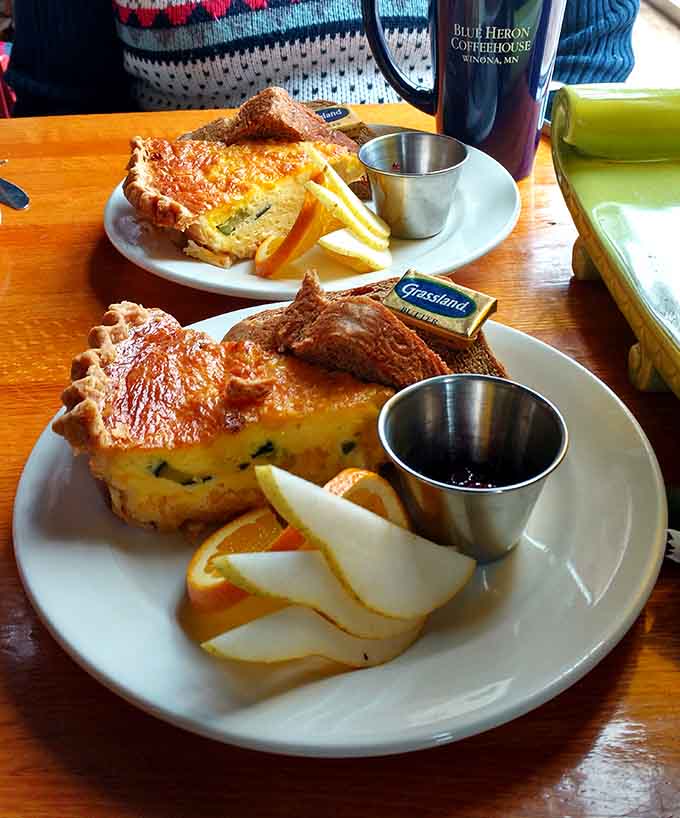 Two generous slices of quiche ready to make someone's day infinitely better, because life's too short for mediocre egg dishes and sad pastry.