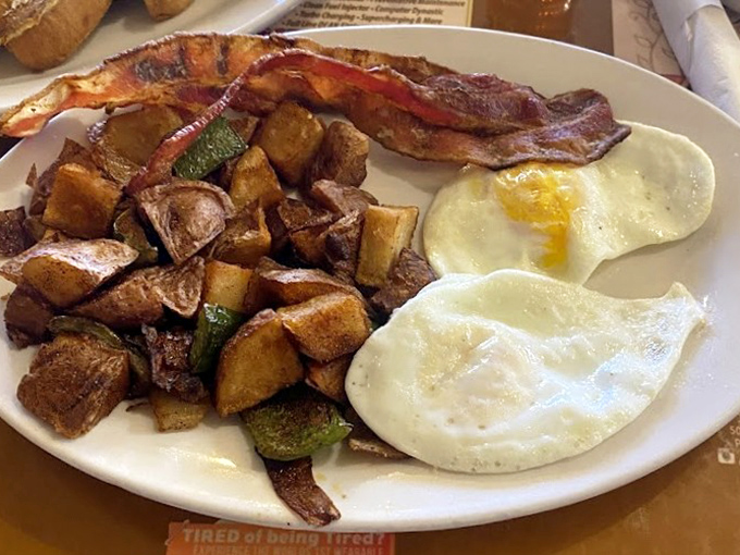 Breakfast Meal: The perfect trio &ndash; eggs sunny-side up, crispy-edged hash browns, and bacon that's found that magical space between chewy and crisp.