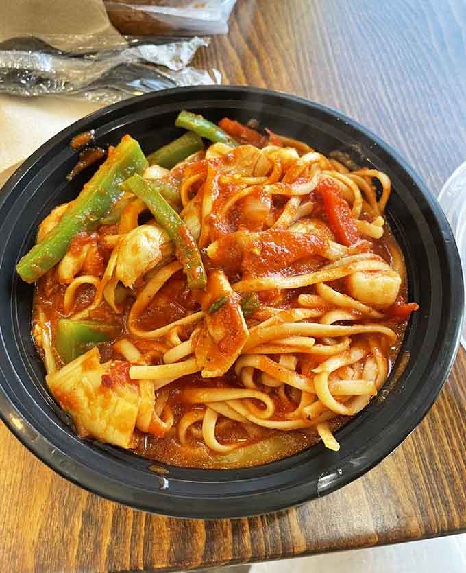 Fresh pasta swimming in vibrant sauce with perfectly cooked vegetables, this dish delivers comfort in every single twirl of your fork.