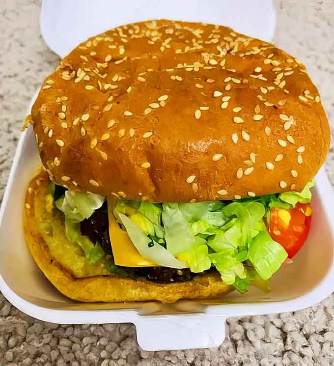 A burger that requires both hands and possibly a strategy session&mdash;complete with a perfectly fried egg and those legendary onion rings.