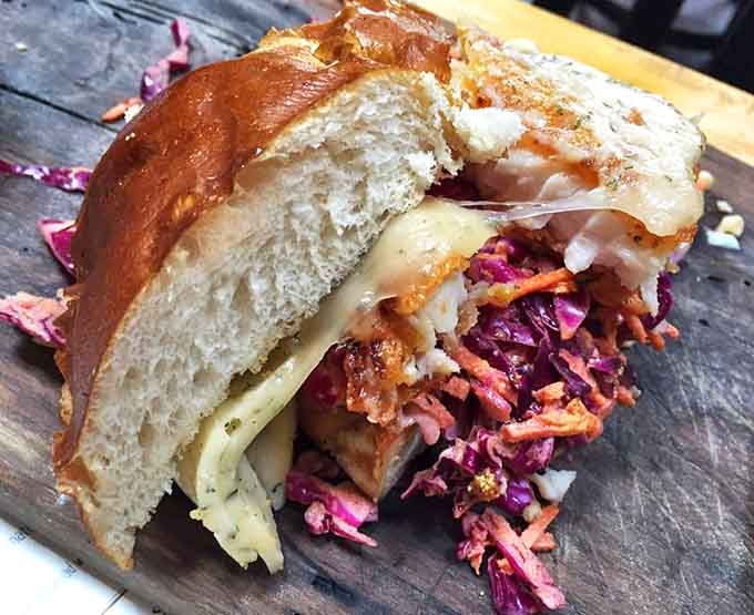 Cornmeal-crusted catfish nestled in a pretzel bun proves Southern classics thrive in the Great Lakes State.