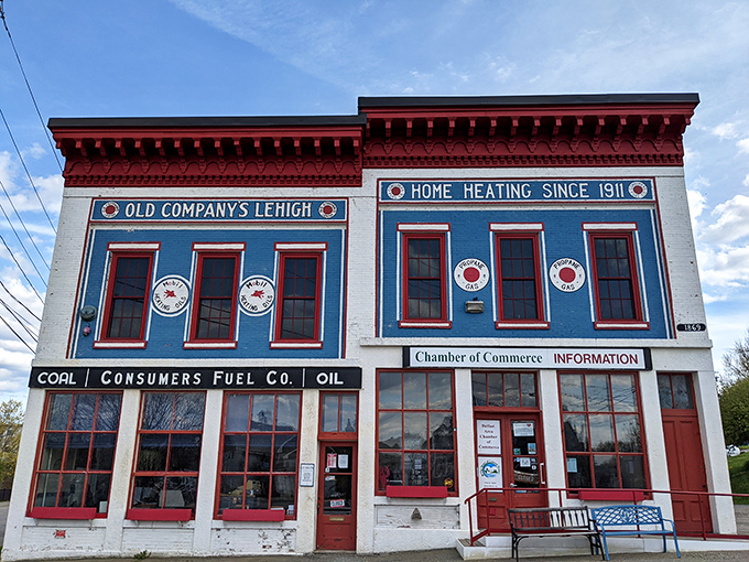 The vibrant blue Chamber of Commerce building stands out like a cheerful greeter, welcoming visitors with its distinctive historic charm.
