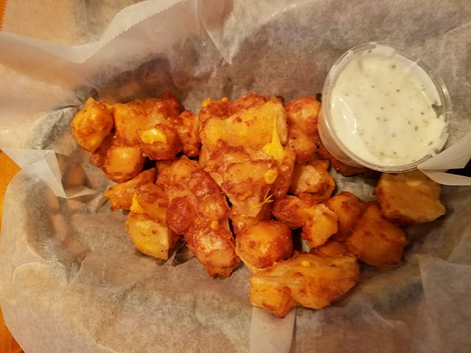Golden nuggets of joy! These hand-battered cheese curds with their perfect crisp-to-gooey ratio make ordinary appetizers seem like distant, lesser relatives.