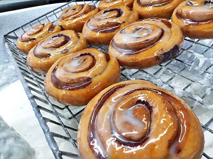 Cinnamon rolls with that perfect spiral and glossy glaze, because apparently making incredible donuts wasn't enough of a challenge for these overachievers.