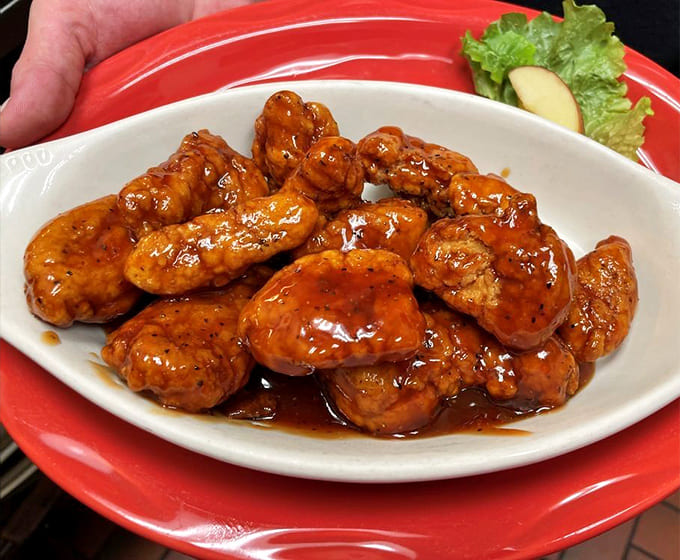These boneless wings glisten with sauce like they're auditioning for a food magazine cover, and honestly, they'd probably get the job.