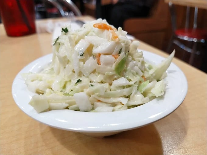 Cecil's coleslaw isn't an afterthought &ndash; it's a crisp, fresh counterpoint that cuts through rich sandwiches with perfect tang.