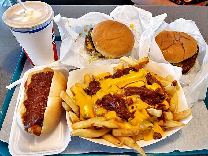 This combo meal has everything you need for happiness: burgers, fries, chili, cheese, and zero regrets whatsoever.