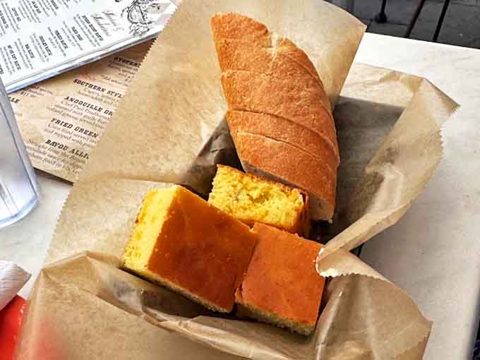 Complimentary cornbread arrives warm and studded with jalapeños—a sweet, spicy hello that says, "Pace yourself, the flavor journey's just beginning."