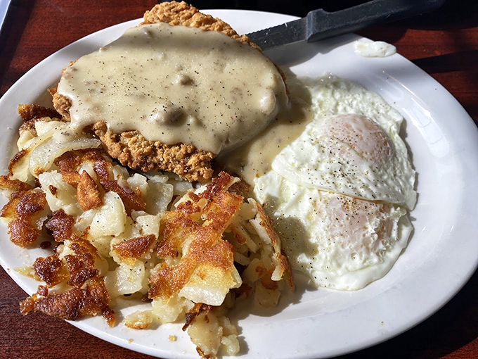 Behold the country fried steak! This crispy, gravy-smothered masterpiece is a breakfast revolution. Forks at the ready, folks!