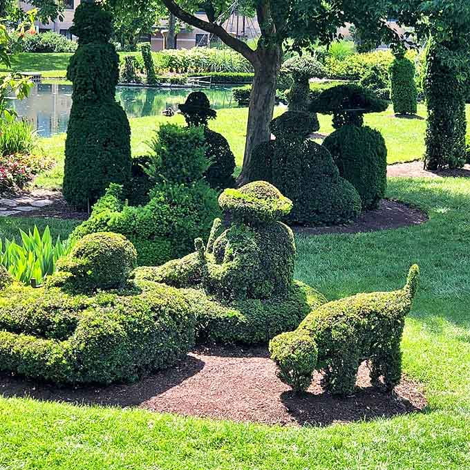 Did someone say treats? A happy pup poses by the garden's vibrant flowers, adding living charm to this artistic haven.