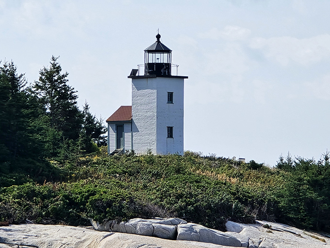 Mark Island Lighthouse stands sentinel at the entrance to Stonington Harbor, a postcard-perfect reminder of Maine's maritime heritage.