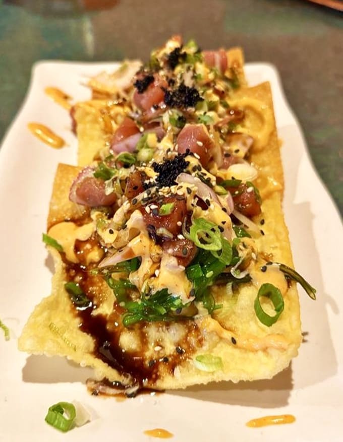 This ahi tuna stack is almost too pretty to eat, like edible architecture with flavors that justify the artistry.