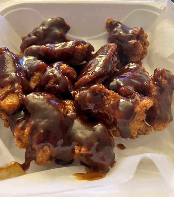 BBQ chicken that's been drizzled and sauced to sticky, finger-licking perfection, napkins absolutely required.