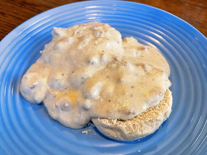 Biscuits and gravy done right, with flaky layers meeting creamy, peppery perfection in a combination that could broker world peace if given the chance.