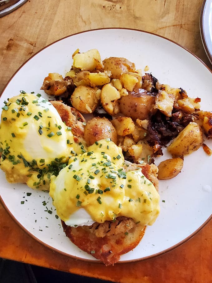 Eggs Benedict: Hollandaise cascades over poached eggs like a yellow waterfall of buttery goodness, making Monday feel like Sunday brunch.