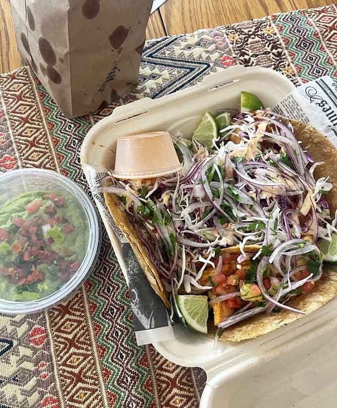 A combination platter featuring both shrimp and chicken tacos demonstrates the kitchen's versatility, with each protein getting the attention it deserves.