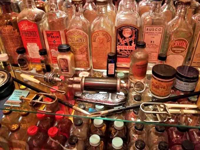 Embalming Bottles: These vintage glass vessels once contained the elixirs of preservation, their faded labels whispering secrets of a profession shrouded in mystery.