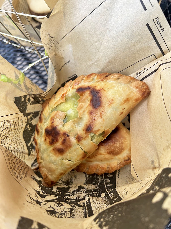 Golden-brown empanadas burst with savory filling, proving some of the best inflight meals happen on the ground.