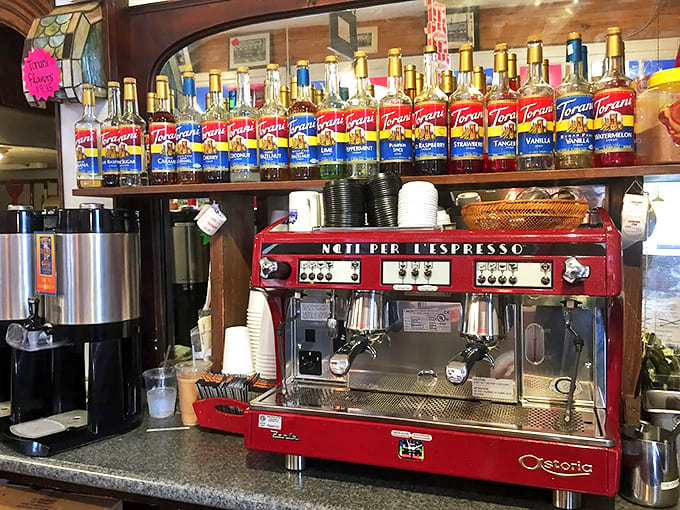 The vintage red espresso maker stands ready to pair perfect coffee with sweet treats while falls rumble outside.