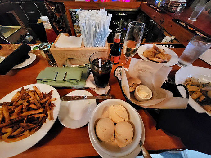 A spread fit for royalty! From crispy fries to creamy ice cream, this table's got more crowd-pleasers than a Beatles reunion concert.