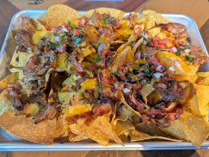 These aren't your average nachos, they're a mountain of chips, cheese, and toppings that could feed a small army or one very hungry person with no regrets.