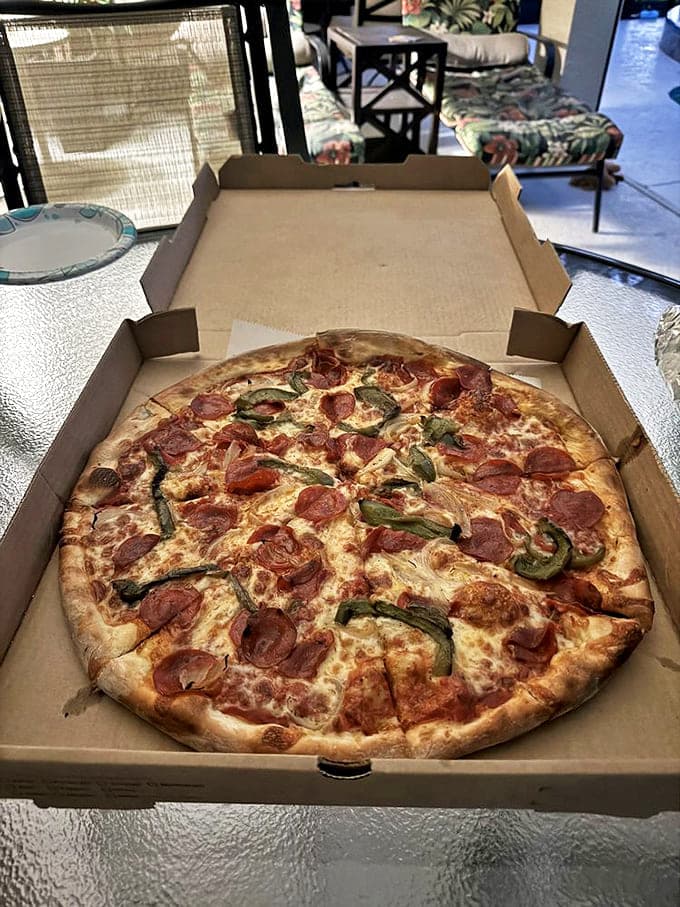 This pepperoni pizza achieves the perfect cup-and-char effect – those little pepperoni bowls collecting flavorful oil that infuses every bite with spicy goodness.