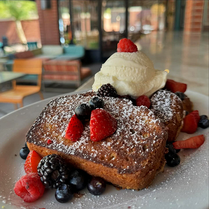 Berry-licious beauty! This French toast is dressed to impress, topped with nature's candy and a scoop of creamy dreams.