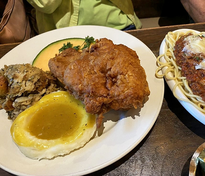 A hearty portion that challenges even the most dedicated eaters &ndash; crispy chicken alongside squash and other farm-fresh sides.