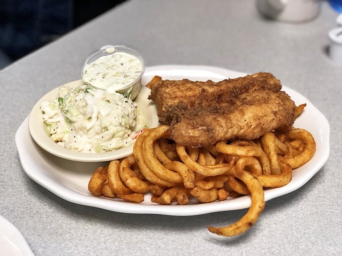 Crispy fried fish meets curly fries in a match made in diner heaven &ndash; comfort food that somehow tastes even better with ocean air.