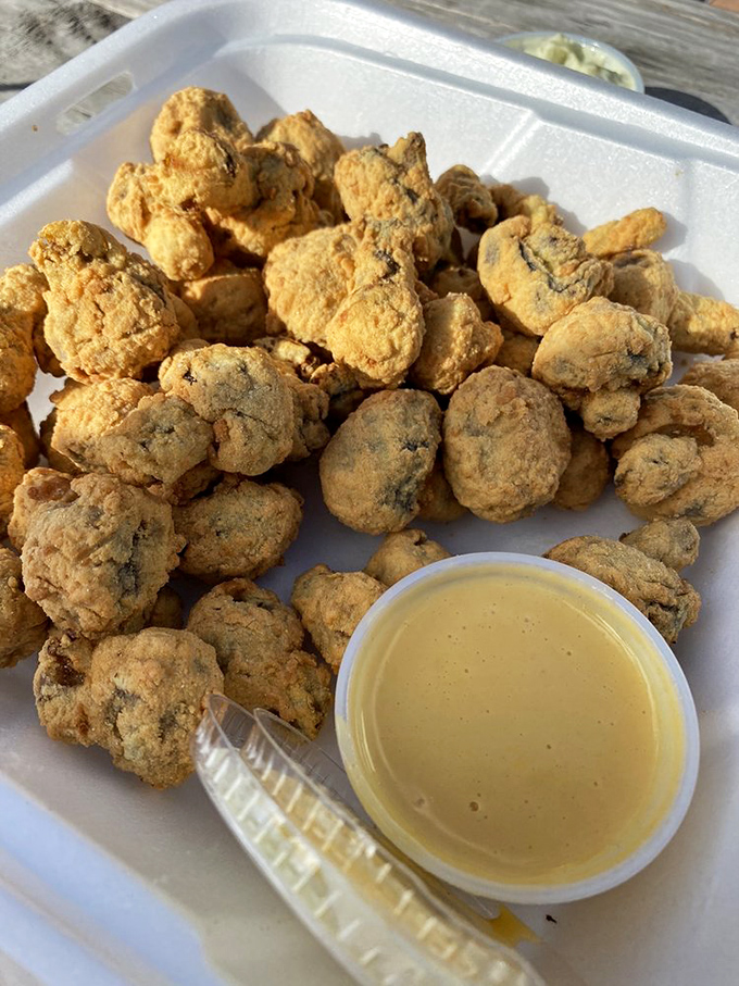 Golden-fried mushrooms with a crisp exterior giving way to juicy centers &ndash; proof that even the sides get star treatment here.