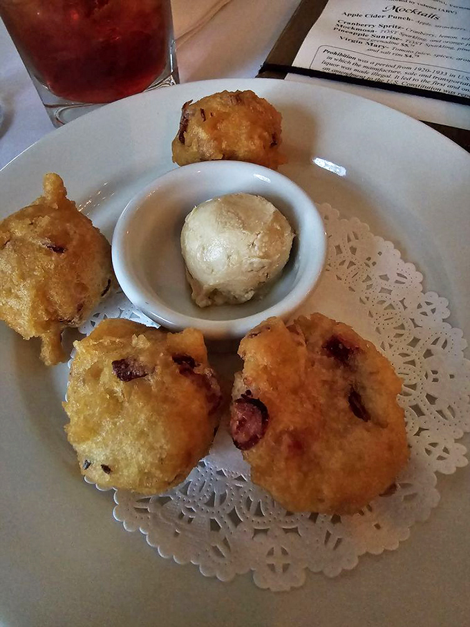 Golden-fried fritters with a crispy exterior giving way to a warm, tender center &ndash; comfort food that transcends centuries.