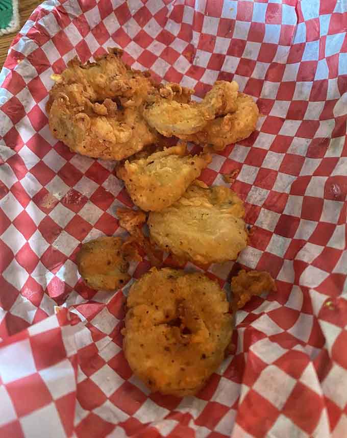 Golden, crispy calamari that's tender inside and crunchy outside, proving that good things really do come in checkered paper baskets.