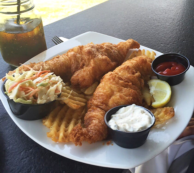 The haddock's perfect white flesh peeks through its golden armor, ready to convert even the most skeptical seafood eaters.