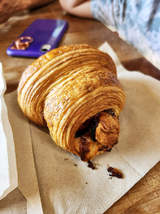 Layers upon flaky layers cradle savory ham and cheese in this croissant that makes you question all other breakfast options.