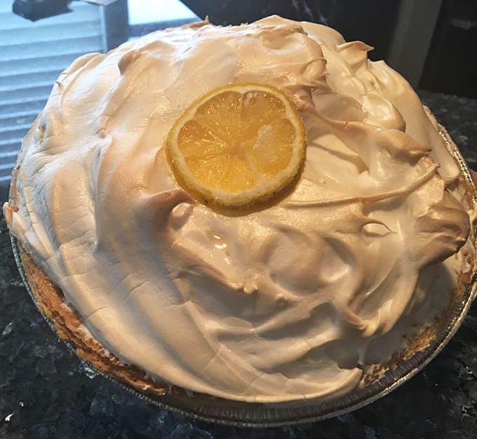 That lemon meringue pie towers with golden-topped meringue over tart lemon filling, proving that sometimes bigger really is better.