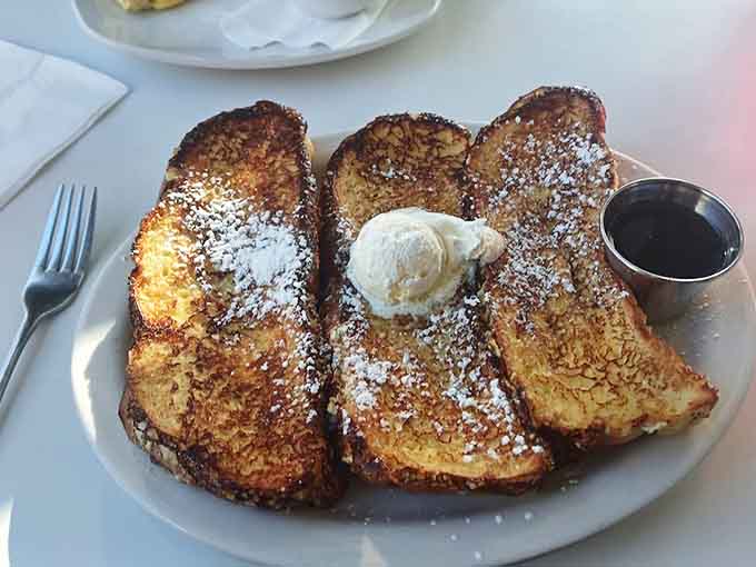 French toast that's crispy on the outside, custardy on the inside, and dusted with enough powdered sugar to make you smile.