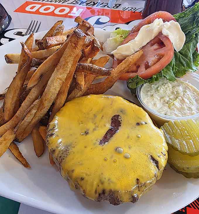 This burger means business, topped with melted cheese and served with fries that could convert even the most devoted salad enthusiast.