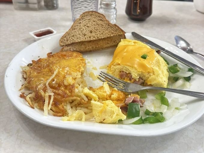 The Denver omelet arrives loaded with ham, peppers, and onions, proving that more is definitely more here.