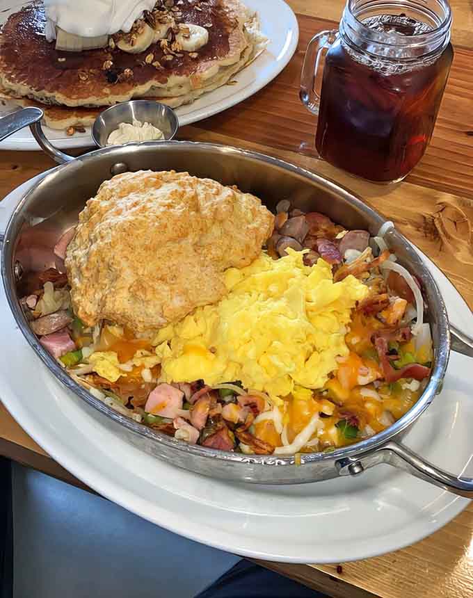 Southern skillet crowned with a golden biscuit is comfort food royalty served in sizzling glory.