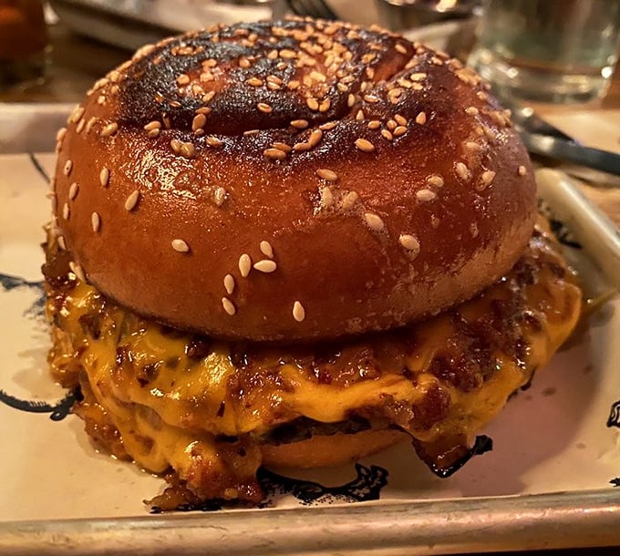 The house burger arrives on a sesame-studded throne, cheese cascading down the sides like delicious lava &ndash; proof that simple pleasures, executed perfectly, create food memories that linger.