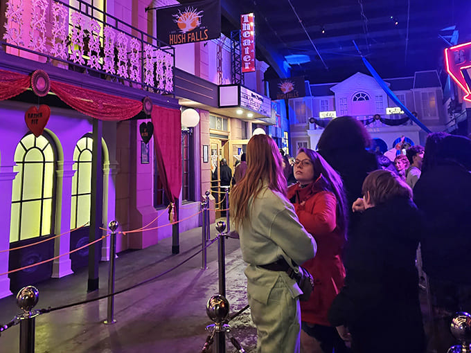 Visitors explore the hauntingly detailed town square, where every storefront hides potential scares and secret entrances.