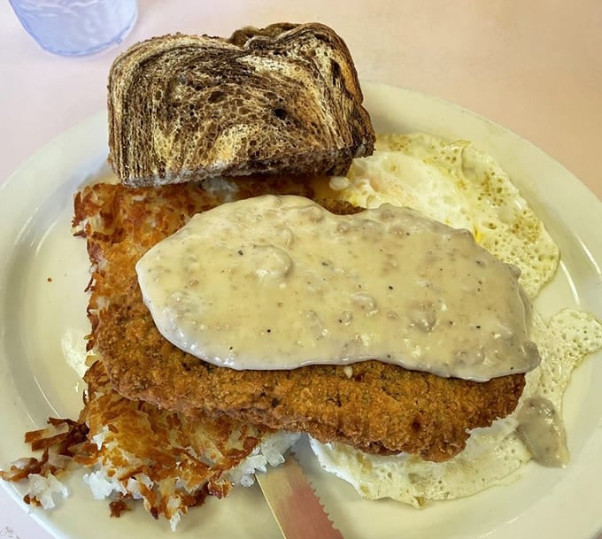 Country fried steak drowning in gravy with hash browns and eggs is basically a hug from your grandmother, assuming she was really good at breakfast.
