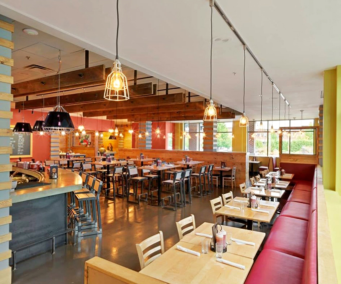 Modern meets cozy in this thoughtfully designed dining room, where wooden accents and warm lighting create an inviting atmosphere.