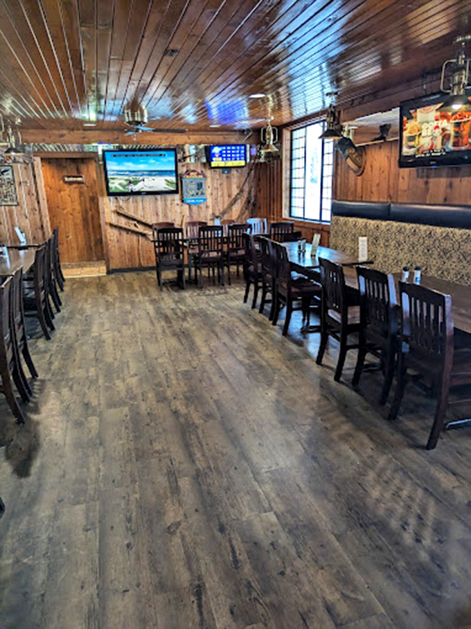 Step into a time capsule of comfort. Wood paneling, cozy booths, and the promise of deliciousness&mdash;Whitey's interior is a warm hug for your soul.