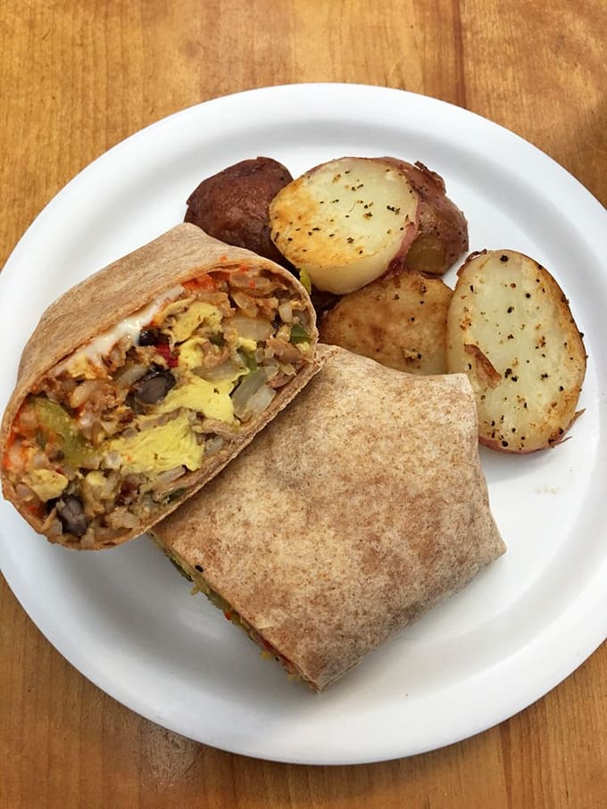 This breakfast burrito, stuffed with eggs and all the good stuff, comes with potatoes that are criminally delicious.